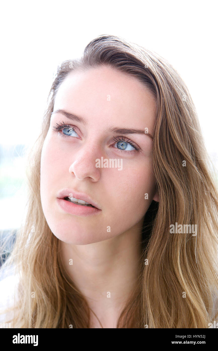Close up portrait of a beautiful young woman looking up Stock Photo - Alamy