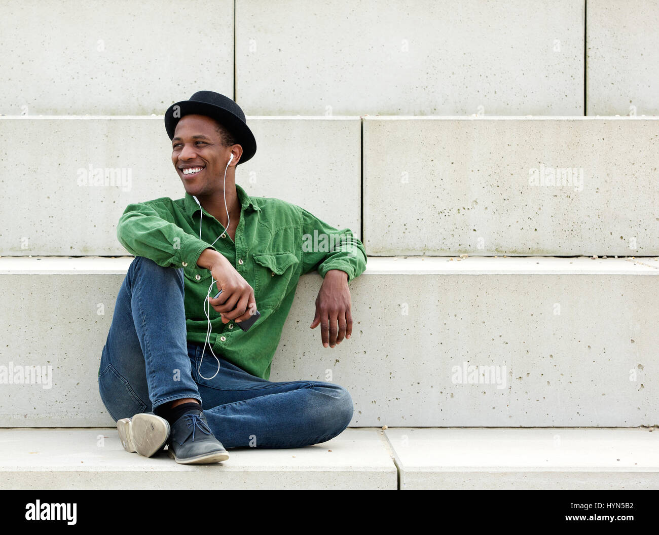 African male smiling listening hi-res stock photography and images - Alamy