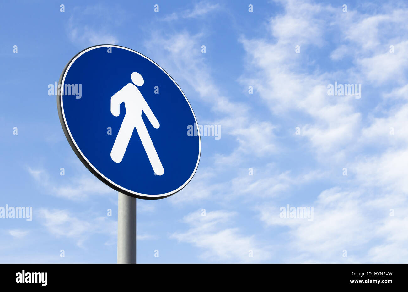 Pedestrian lane road sign on blue sky background Stock Photo - Alamy
