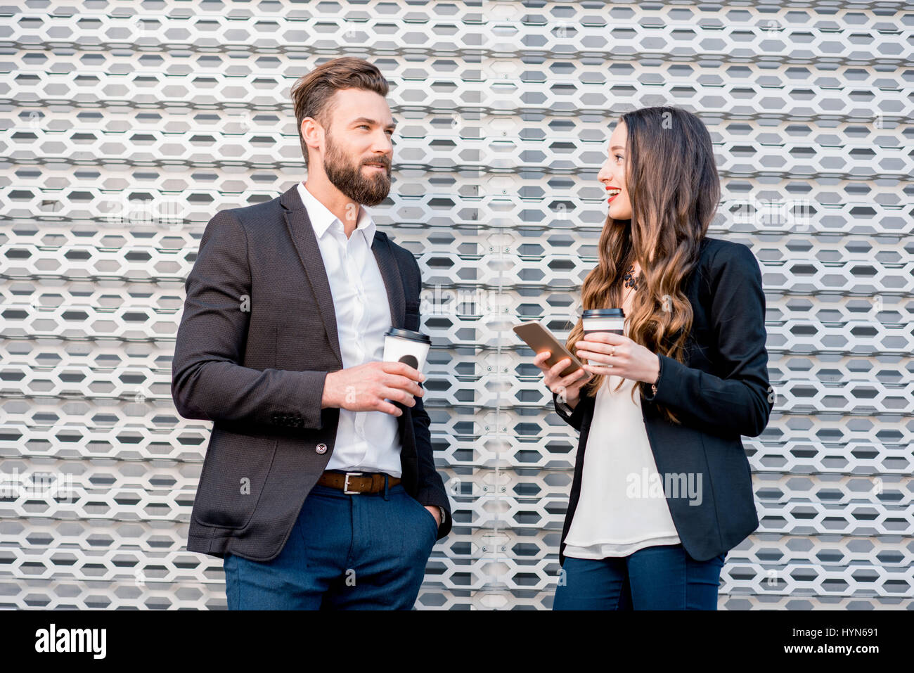 Couple standing outside office hi-res stock photography and images - Alamy