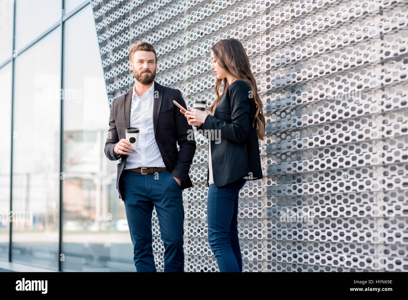 Couple standing outside office hi-res stock photography and images - Alamy