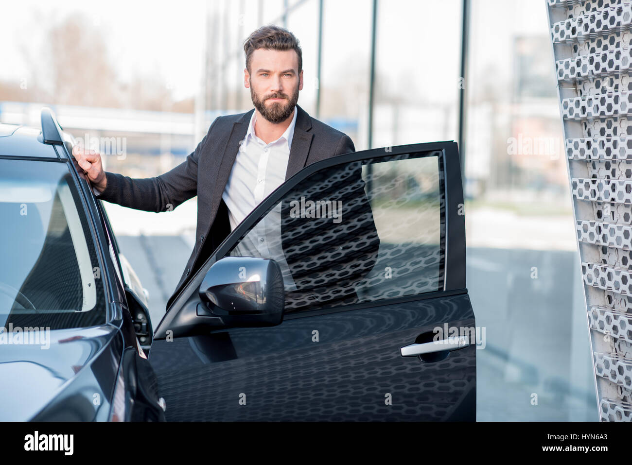 Man standing near white car hi-res stock photography and images - Alamy
