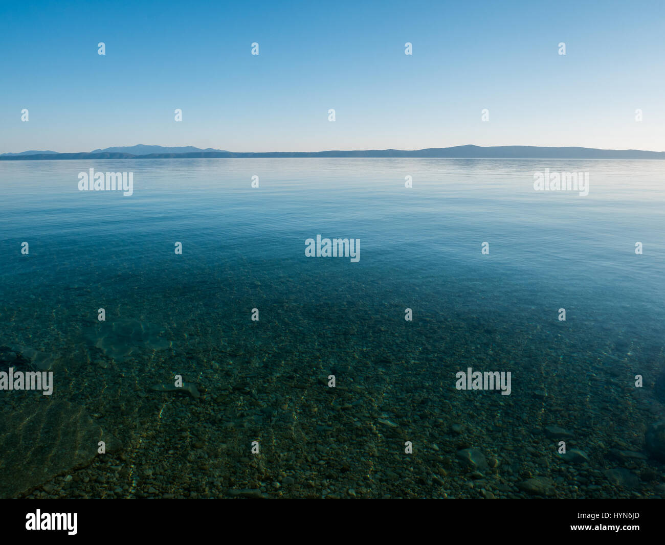 Crystal clear Adriatic sea landscape with island Hvar at background ...