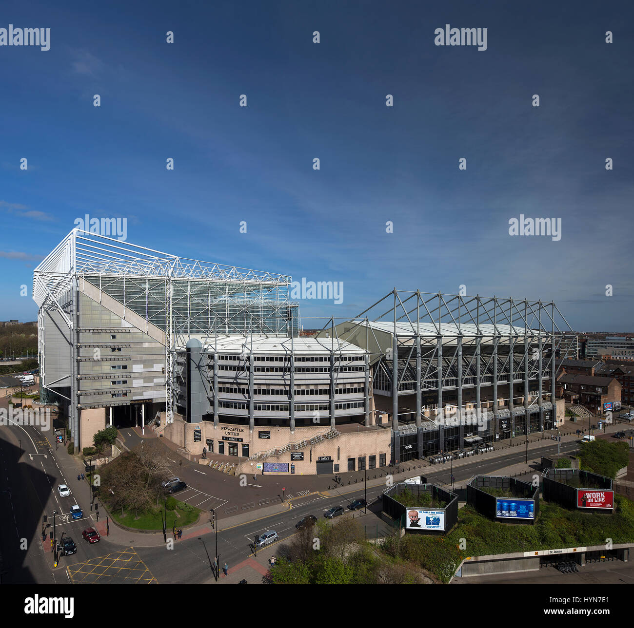 A daytime external view under sunny skies of St James' Park football ...
