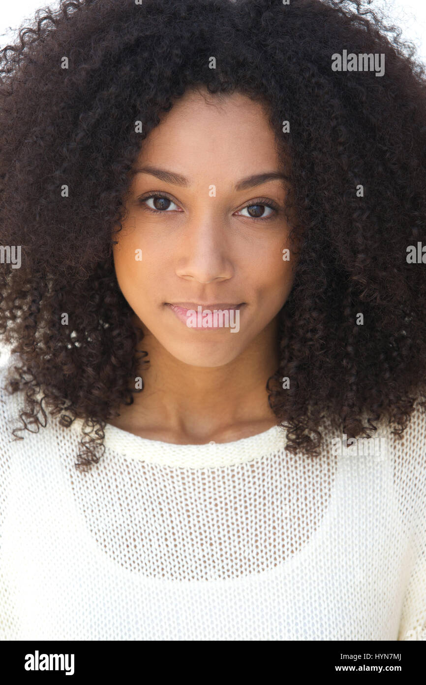 Close up portrait of a cute young woman with curly hair grinning Stock ...