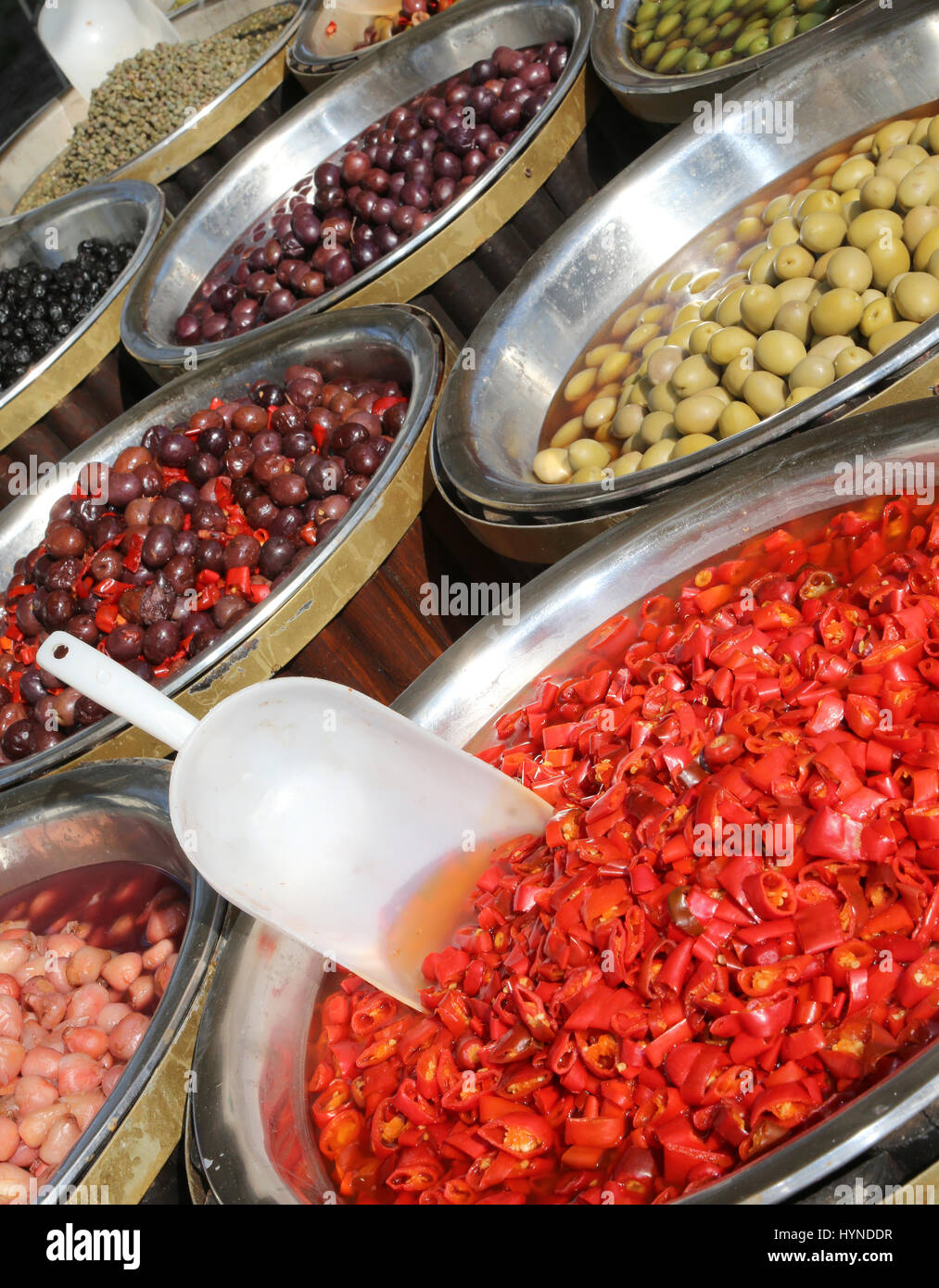 market with product of southern Italy with big olives and red peppers ...