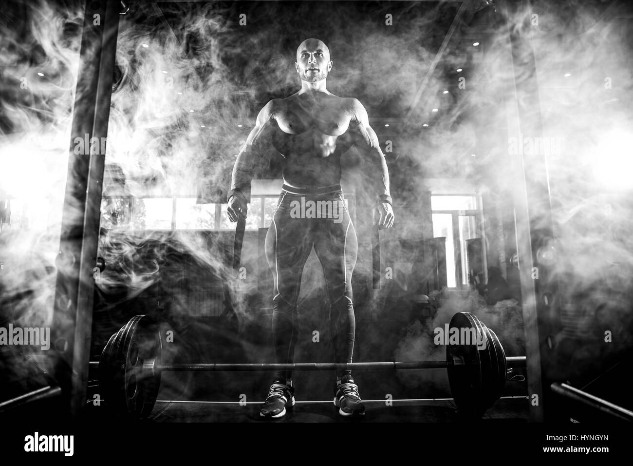 Bodybuilder preparing for deadlift of barbell. Smoke Stock Photo - Alamy
