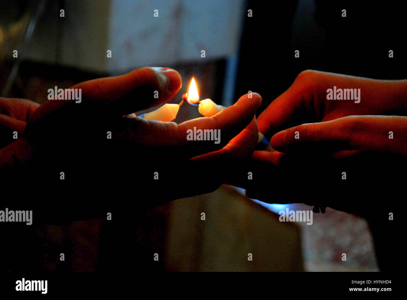 Candle lighting Lighting up one another’s candle in a solemn ceremony ...