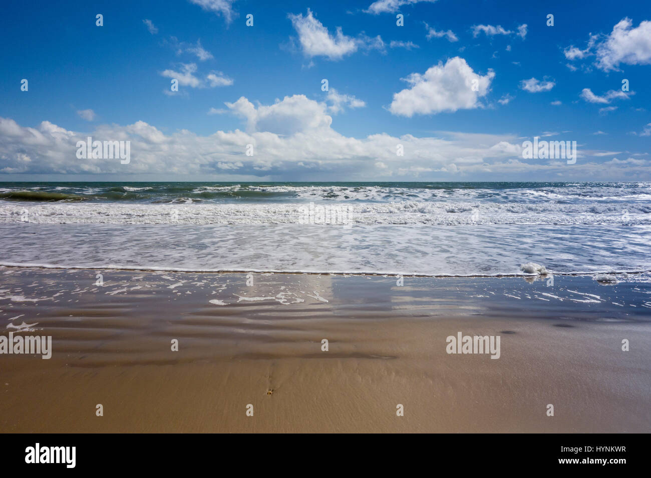 Bournemouth Beach showing edge of the sea with tide coming in over the ...