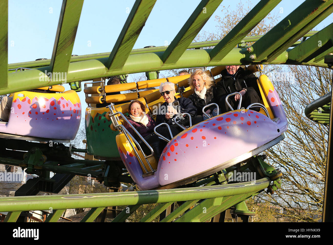 105-year-old Jack Reynolds (second left) rides the Twistersaurus ...