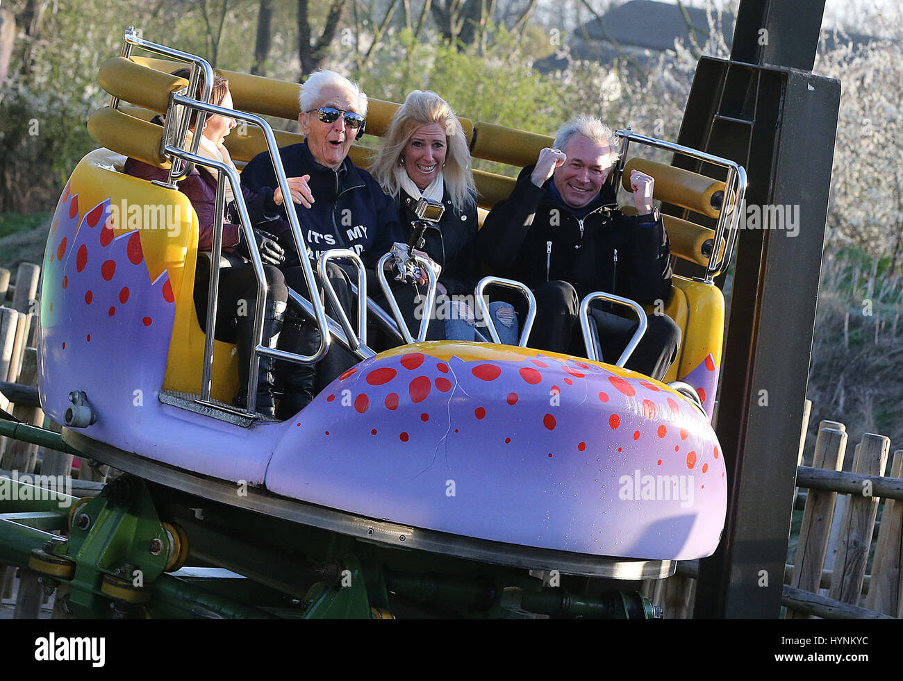 105-year-old Jack Reynolds (second left) rides the Twistersaurus ...