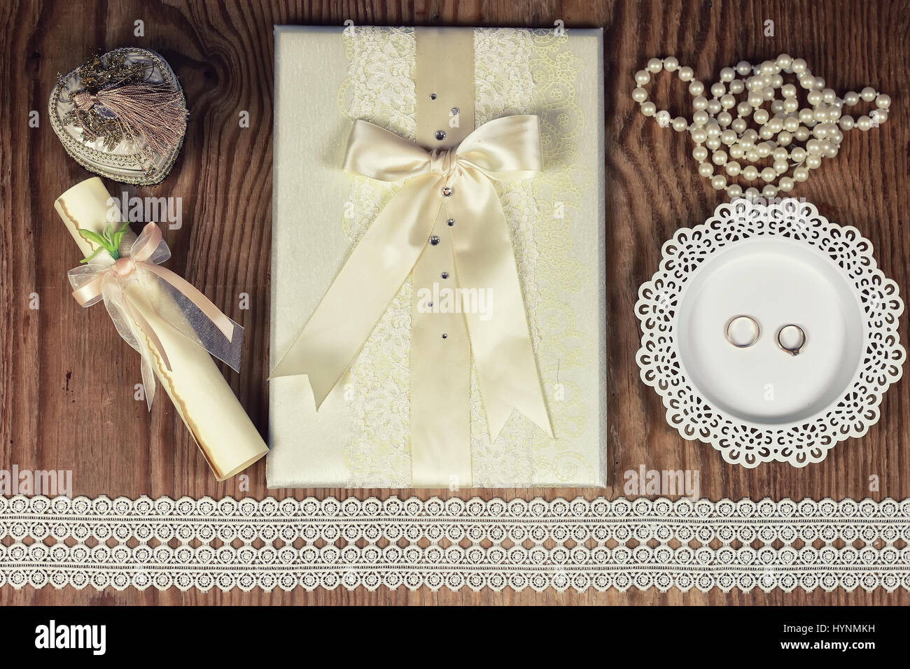 wedding ring invitation wood background Stock Photo - Alamy