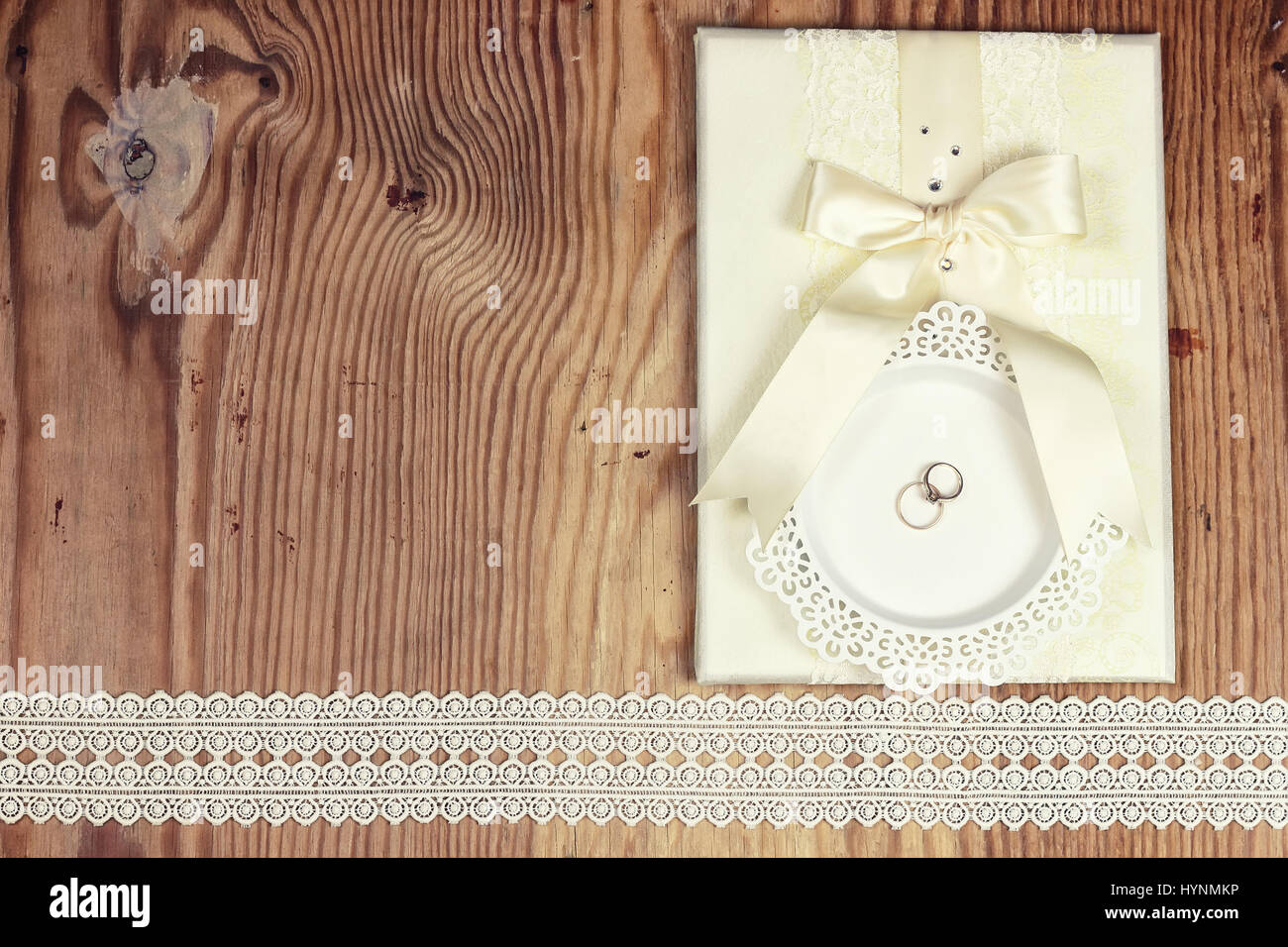 wedding ring invitation wood background Stock Photo - Alamy