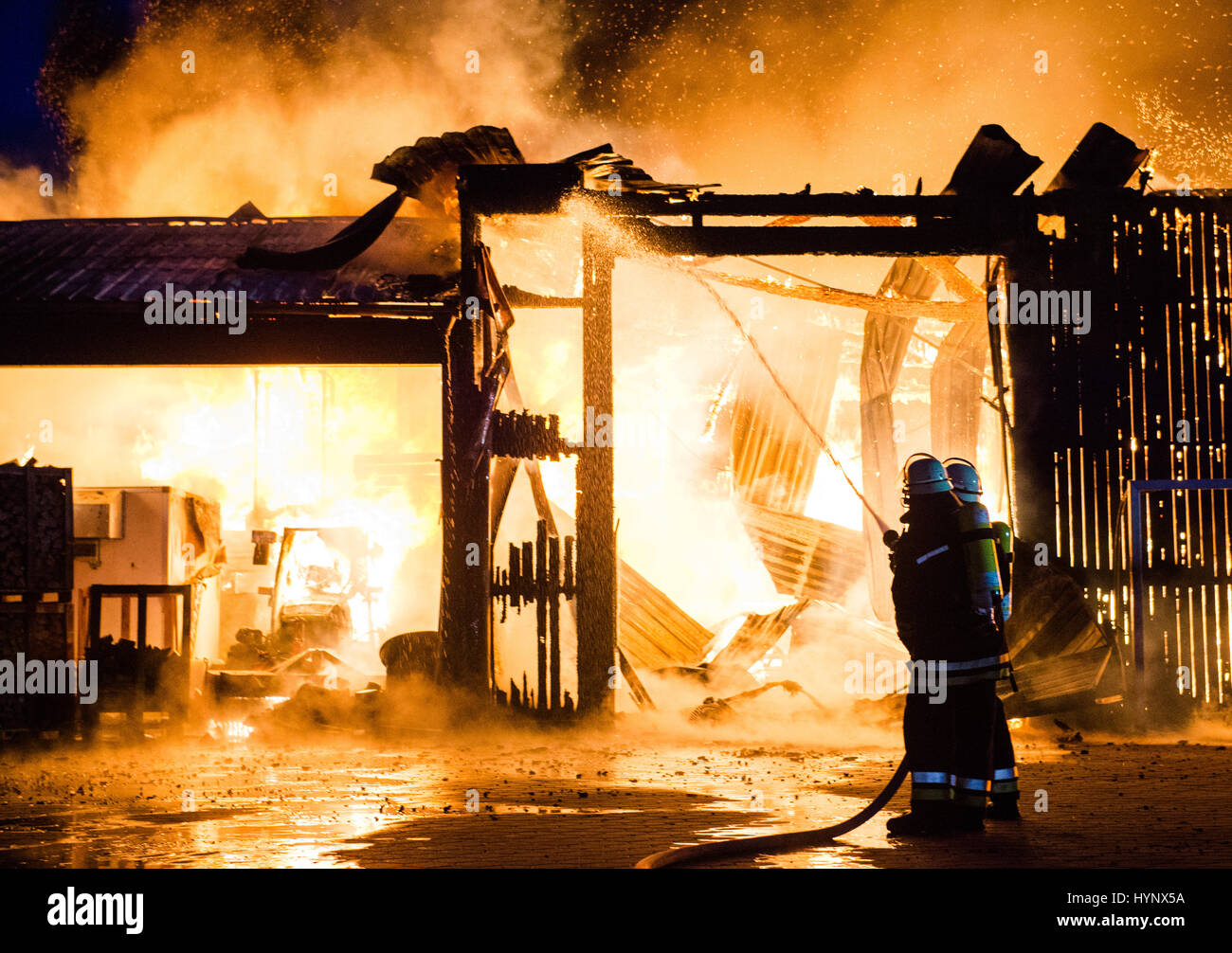 Hamburg, Germany. 5th Apr, 2017. Firefighters extinguish a fire in a ...