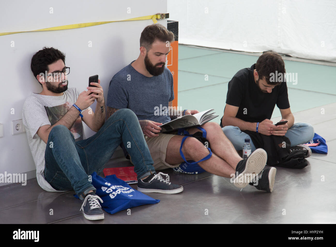 Barcelona, Spain, April 6 2017 Some people read books, some people read ...