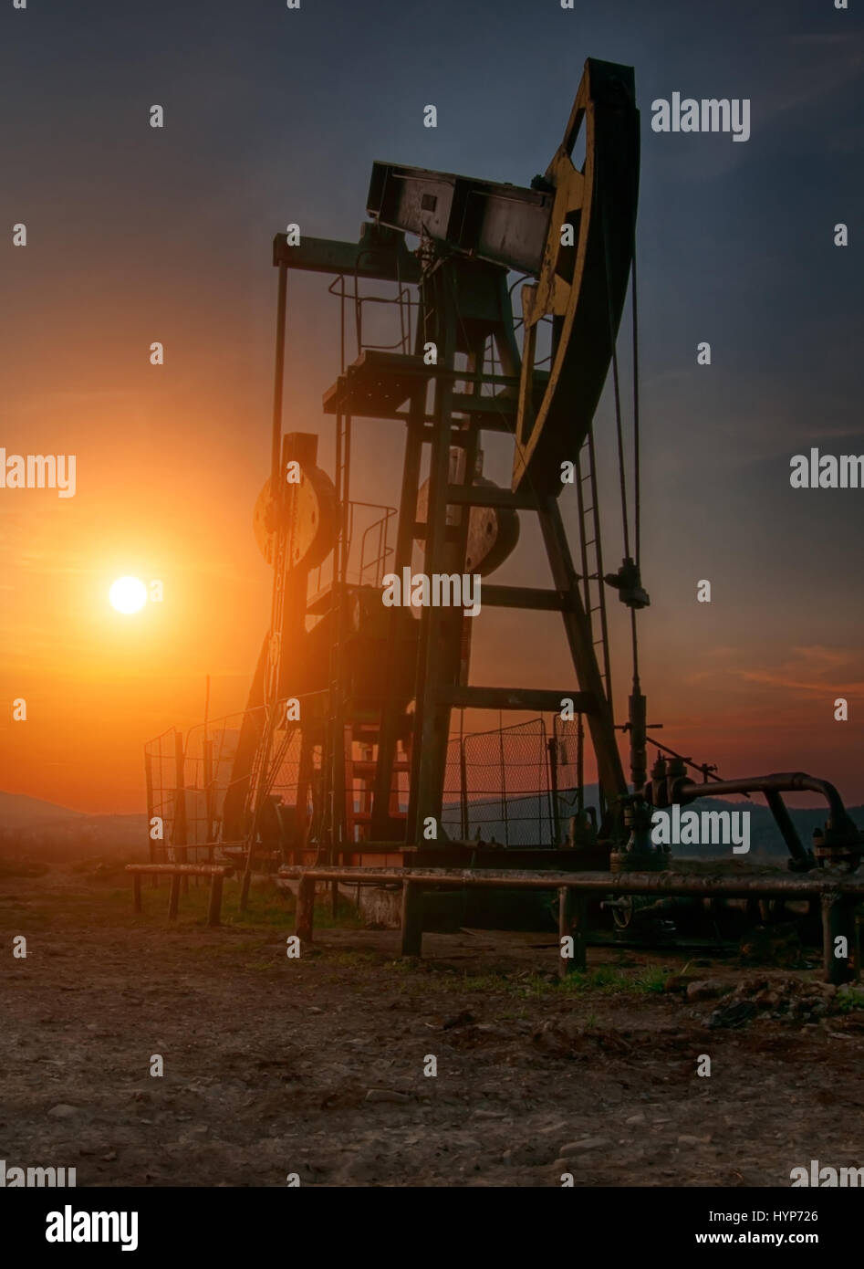 oil pump on orange sunset Stock Photo - Alamy