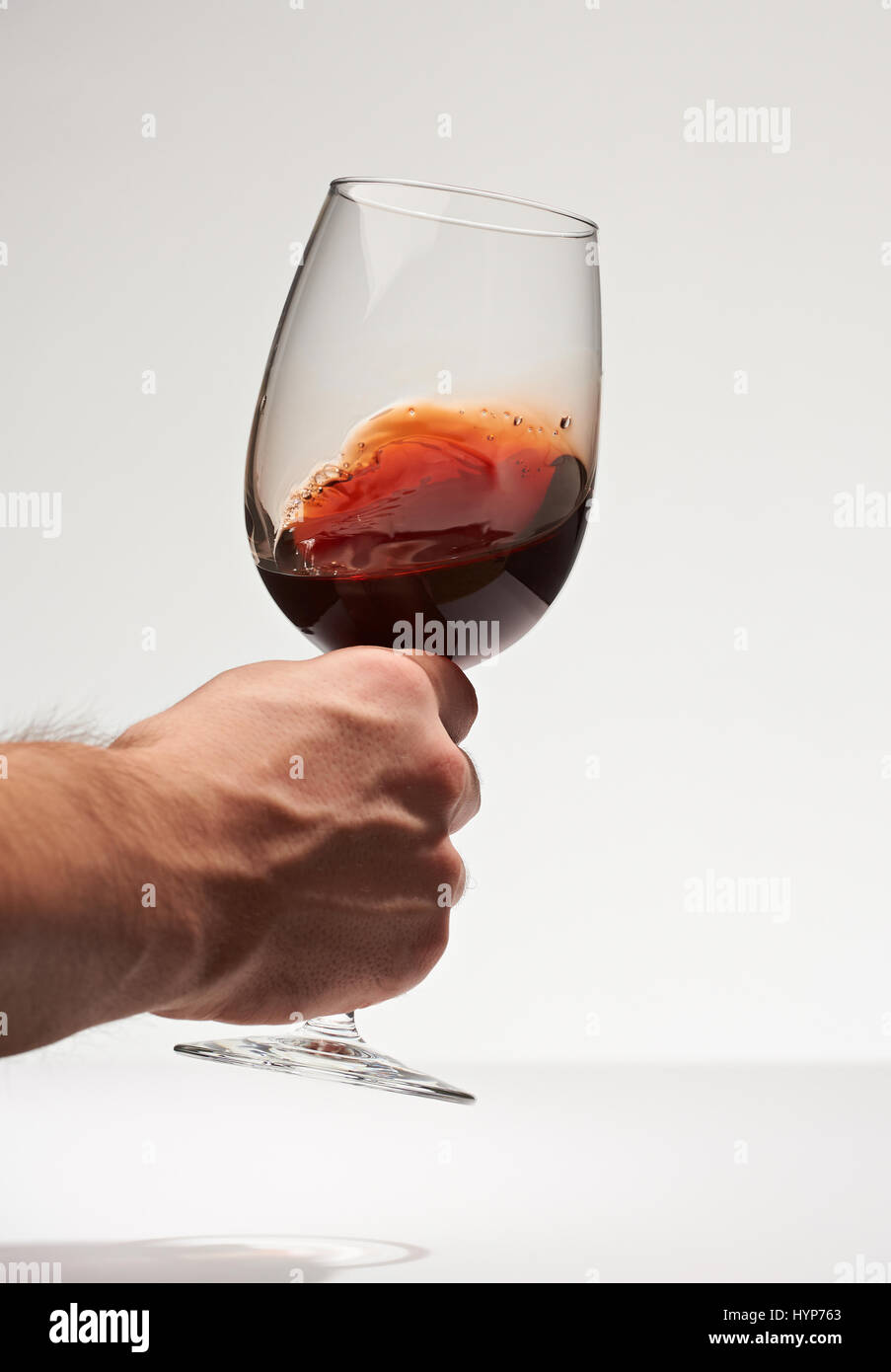 Elegance red wine drink glass holding hand isolated close-up Stock ...