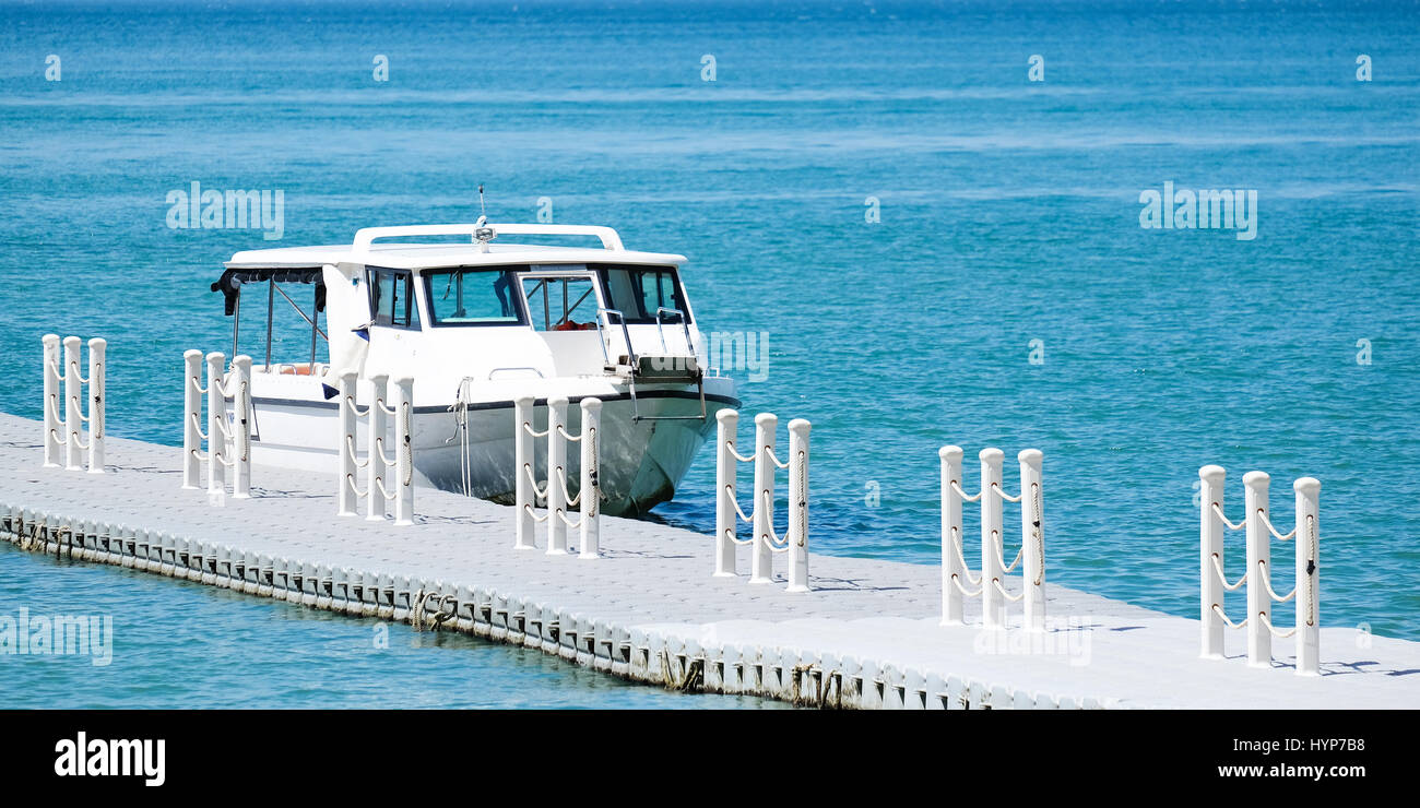 Speed Boat floating in the harbor Stock Photo - Alamy