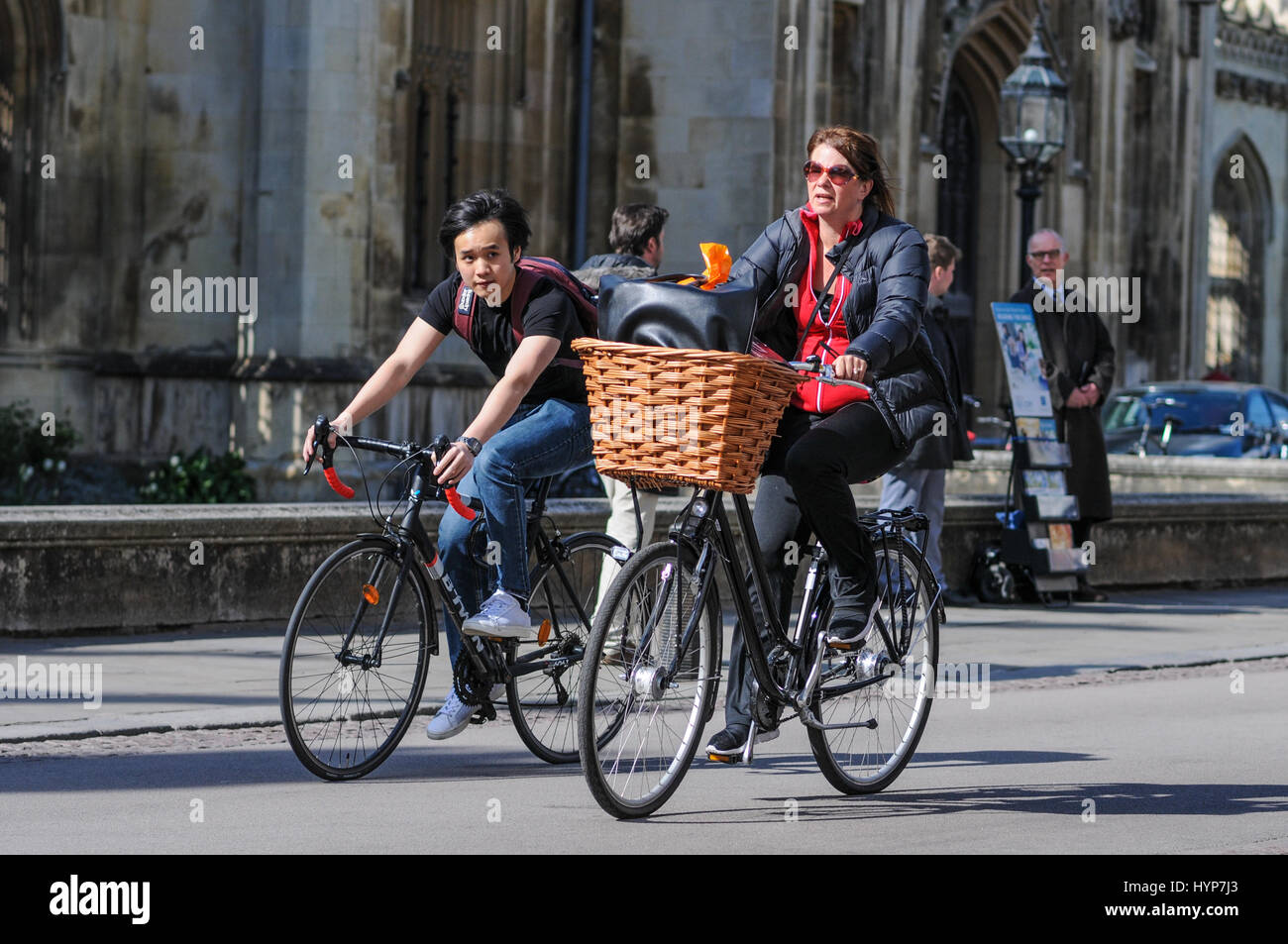 Woman lady cyclist riding a bike cycle bicycle in Cambridge ...