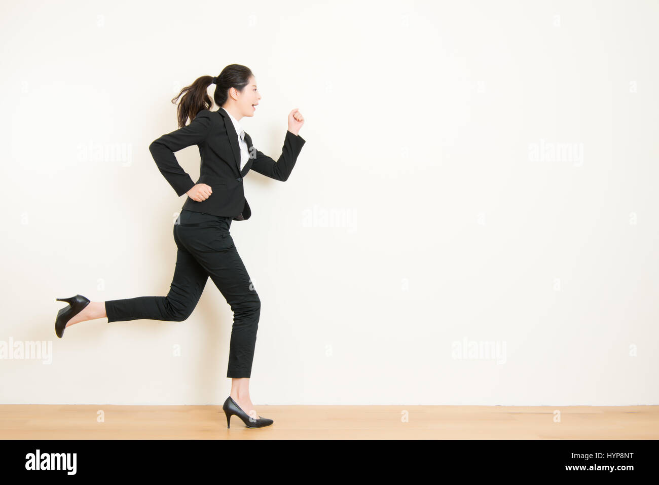 Young asian businesswoman with running on white background of indoor ...