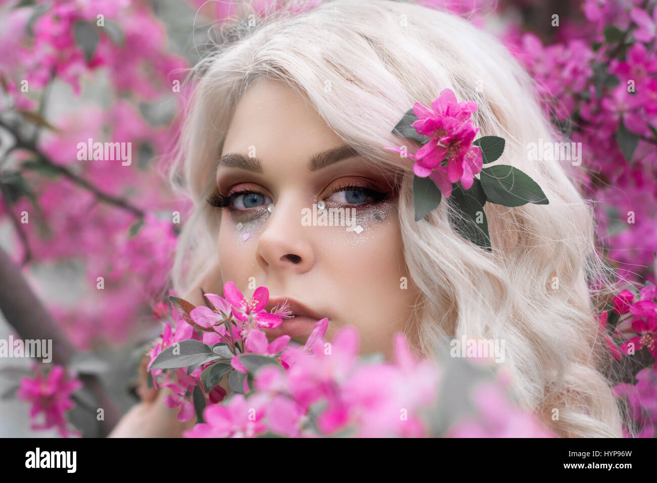 Woman surrounded flowers hi-res stock photography and images - Alamy