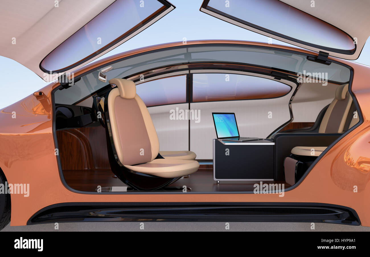 Self driving car interior concept. A laptop computer on the foldable ...