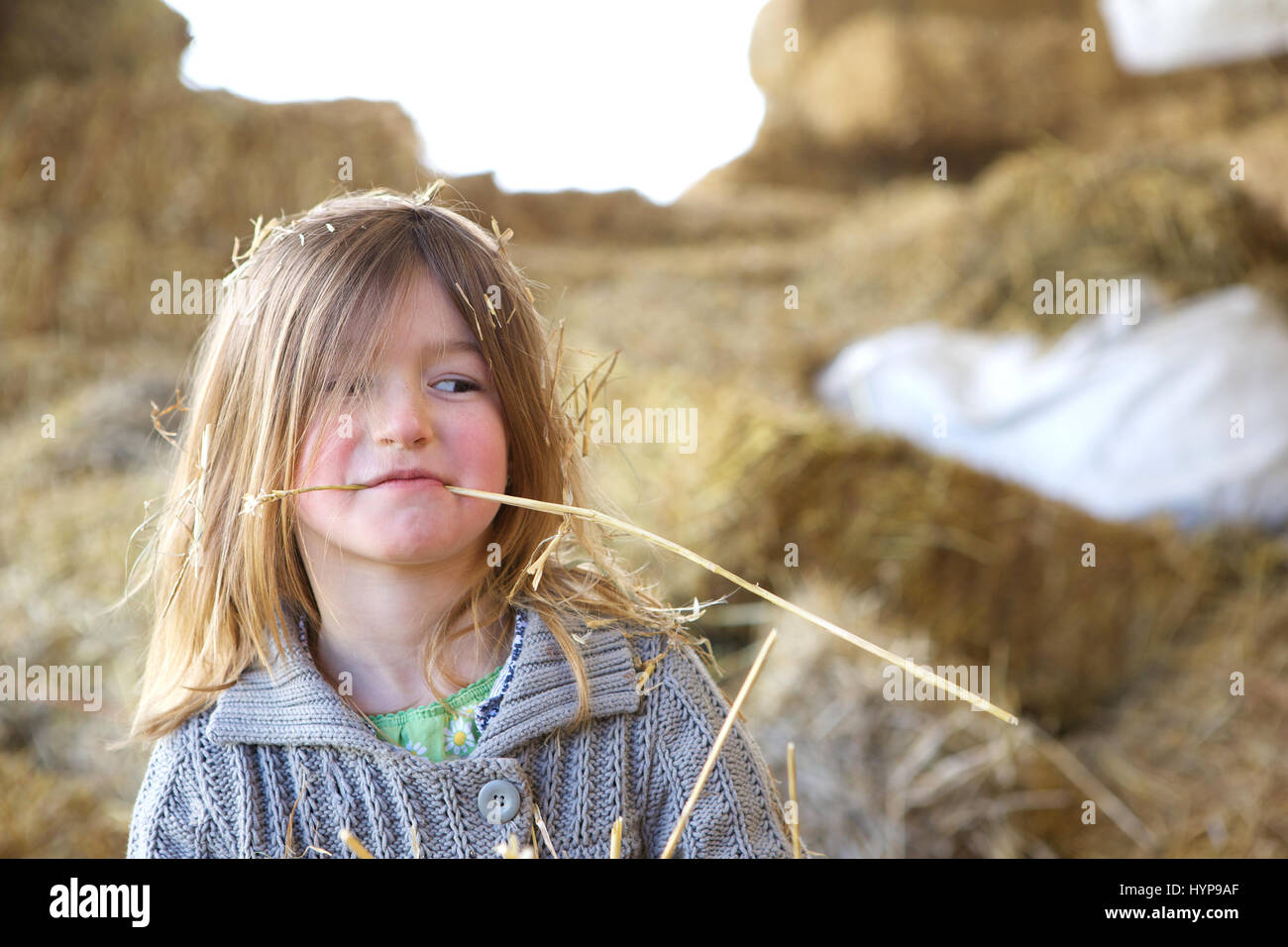 Close up portrait of a cute kid with straw in mouth Stock Photo - Alamy