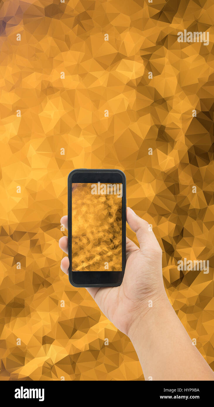 Phone on hand with Bokeh polygon Stock Photo - Alamy