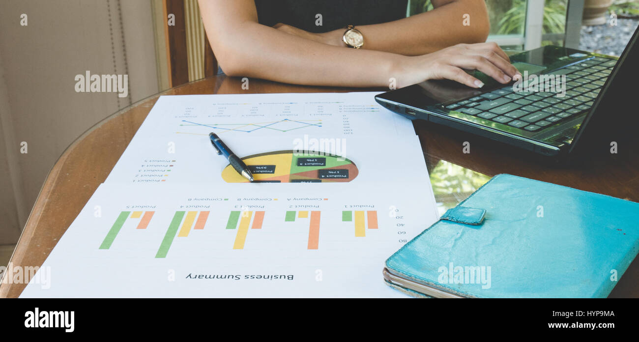 Woman use computer for work with Business summary or Business plan ...