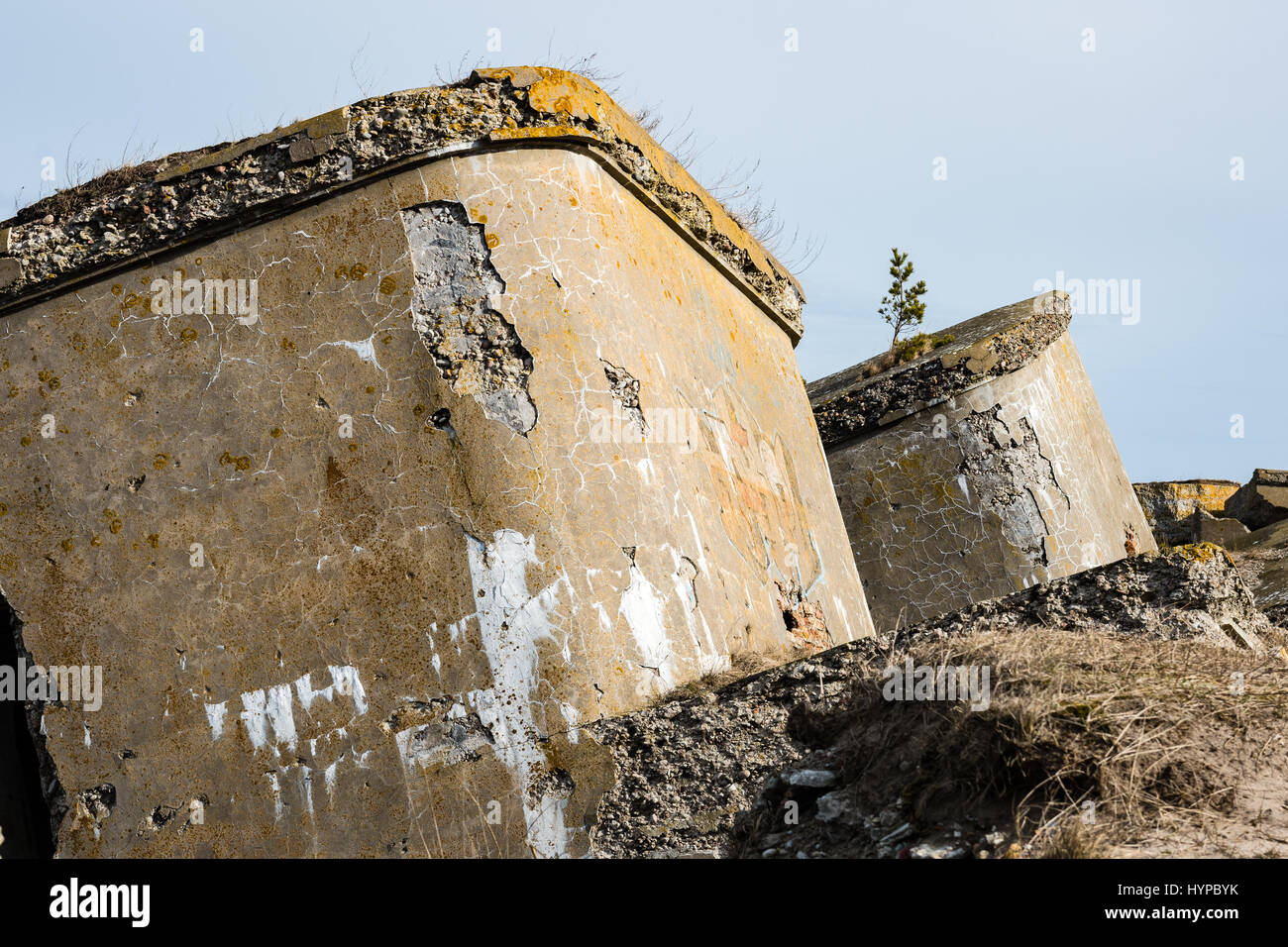 old war fort ruins on the beach with high waves in sunset. Liepaja ...