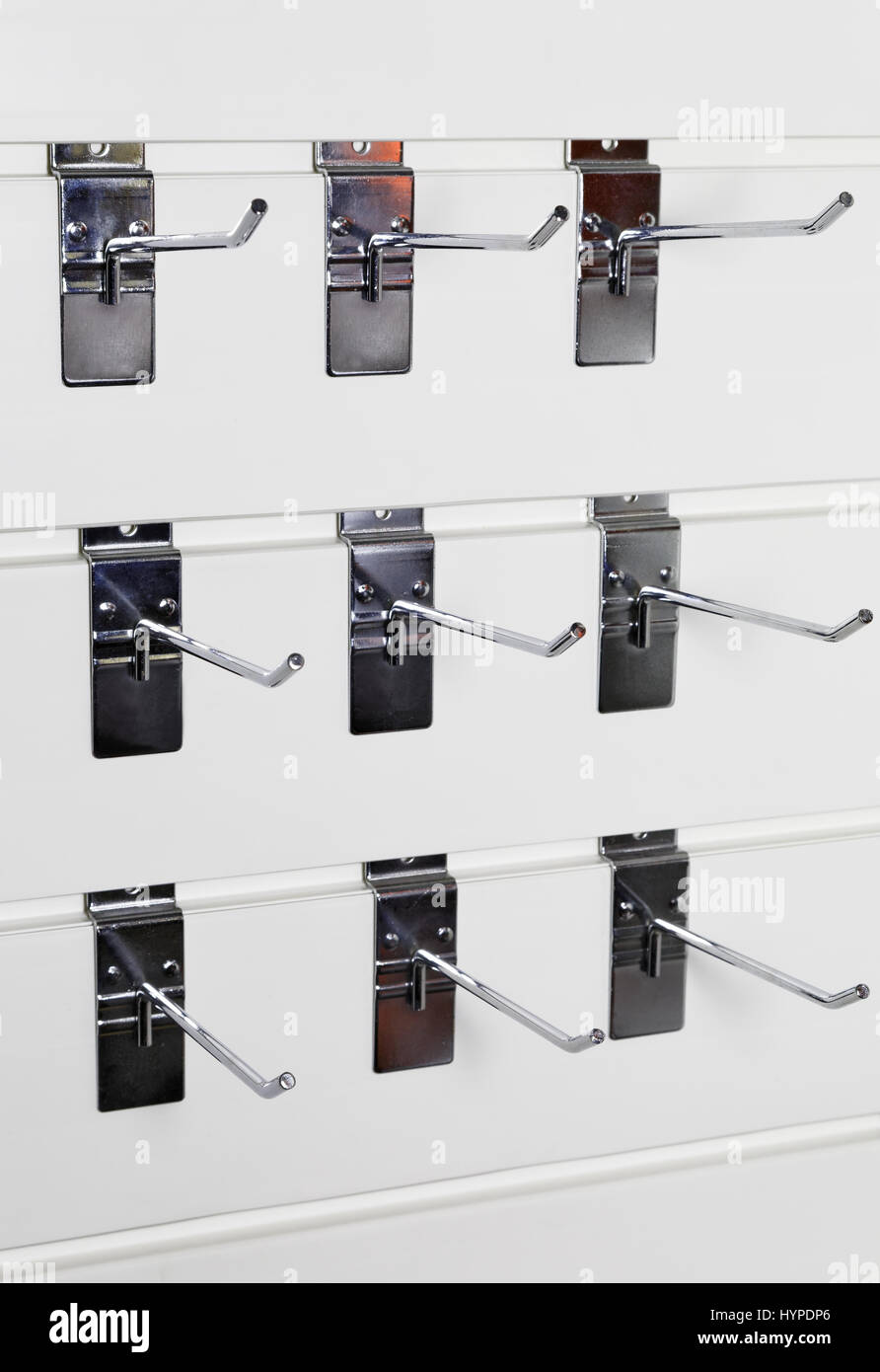 Metal holders for the goods on the demountable economy panel Stock ...