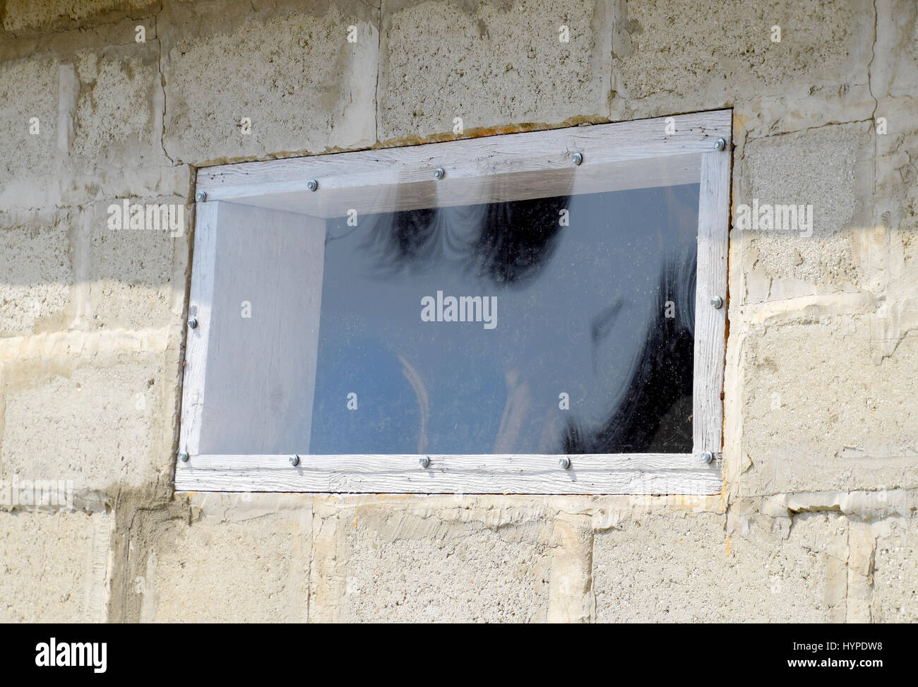 A window made of plexiglas in a concrete wall Stock Photo - Alamy