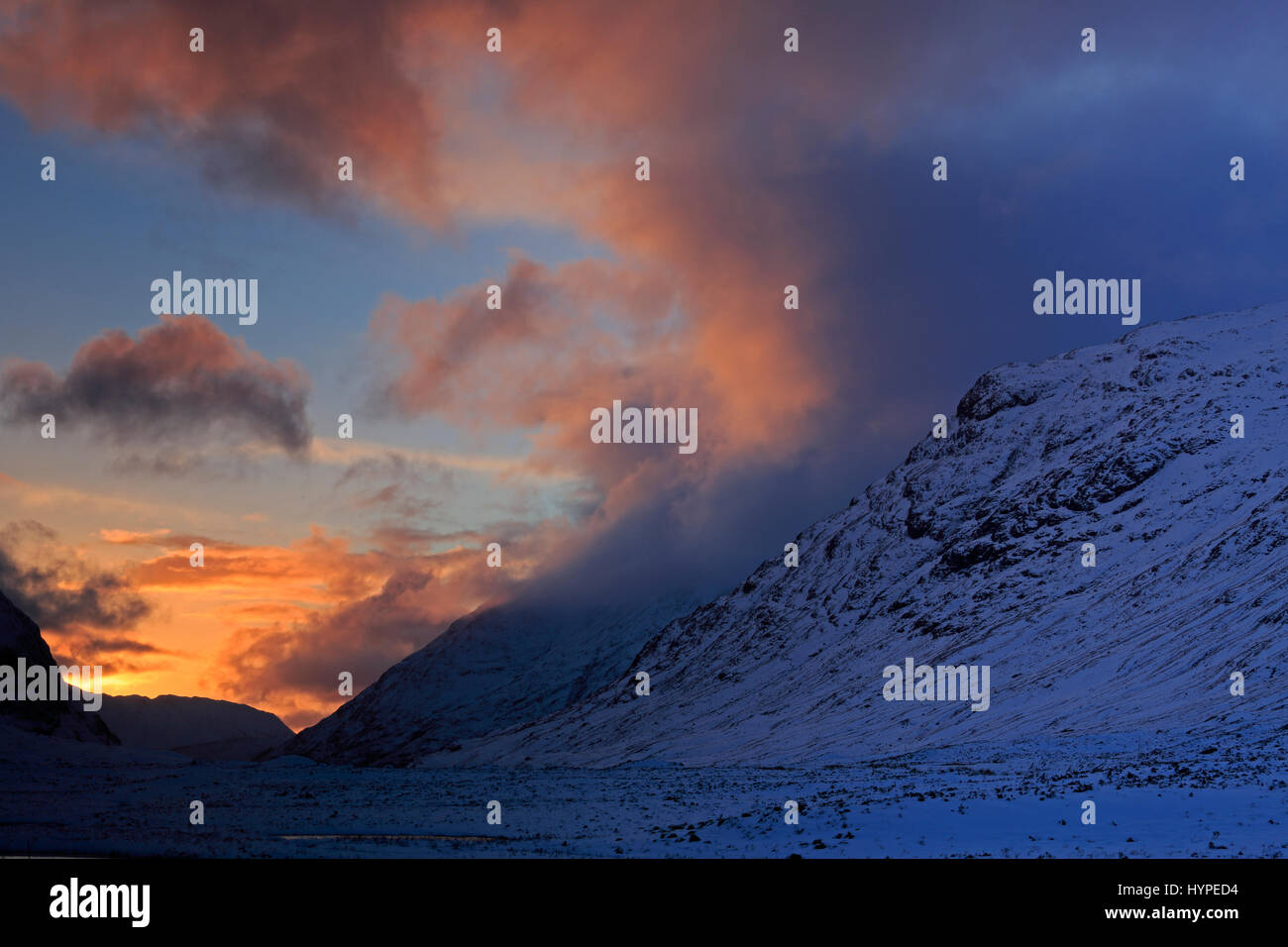 Looking down Glencoe at sunset in March Stock Photo - Alamy