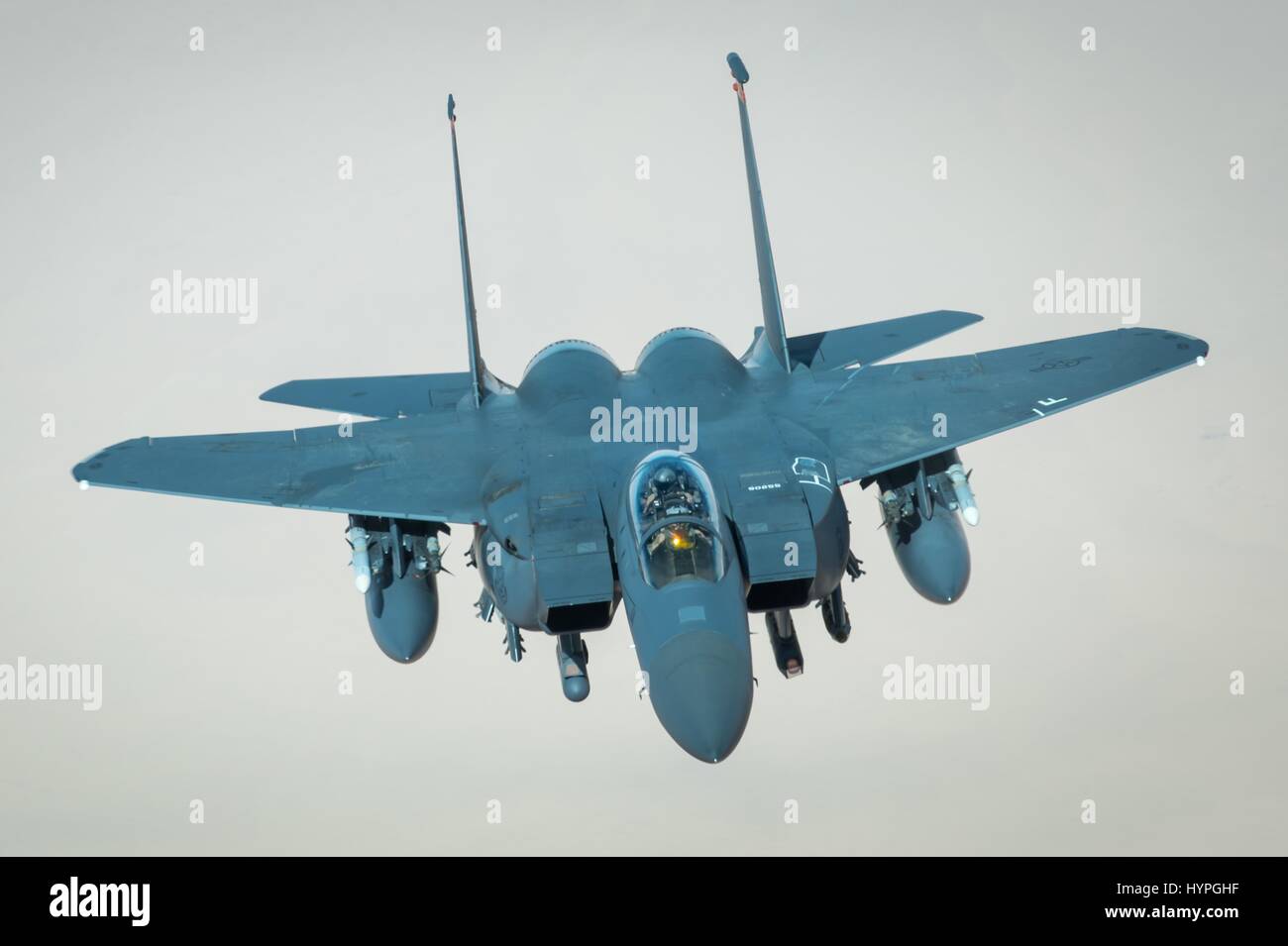 A USAF F-15E Strike Eagle fighter jet aircraft in flight during ...