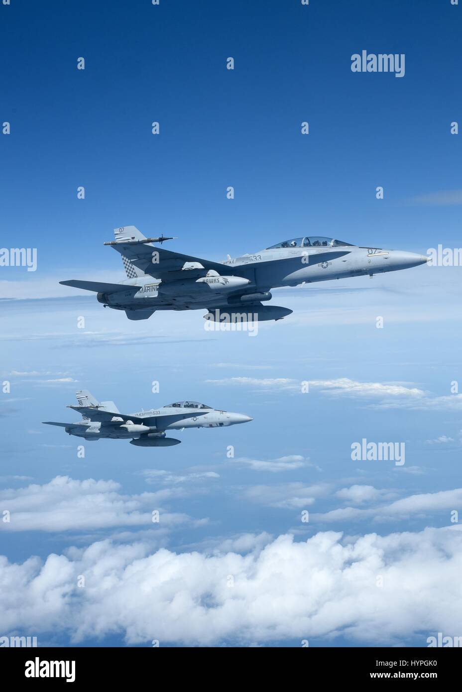 U.S. Navy and Marine Corps F/A-18 Hornet fighter aircraft fly in ...