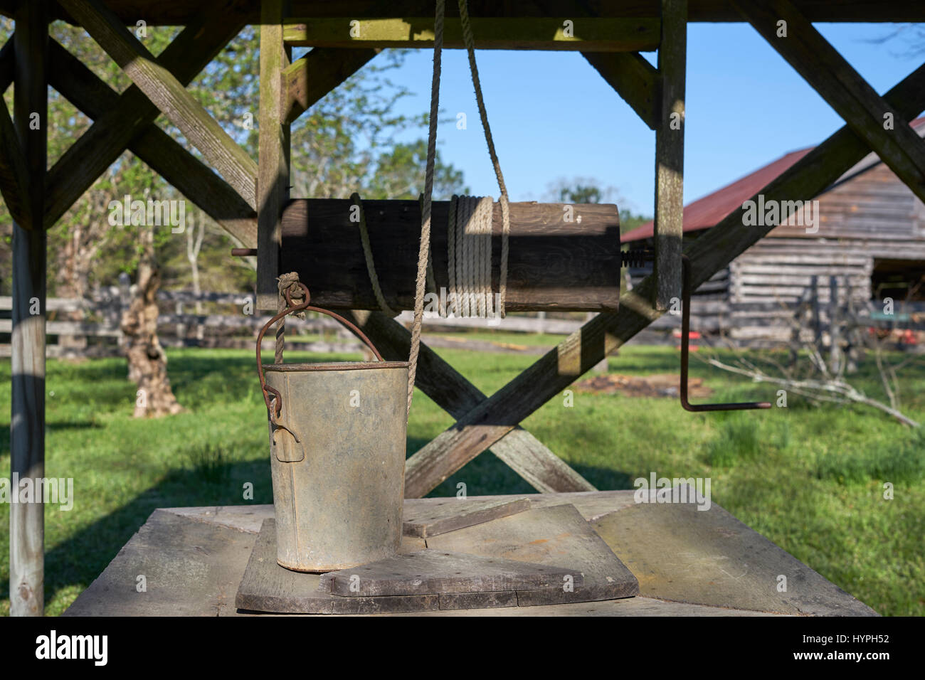 Old stone well with bucket hi-res stock photography and images - Alamy