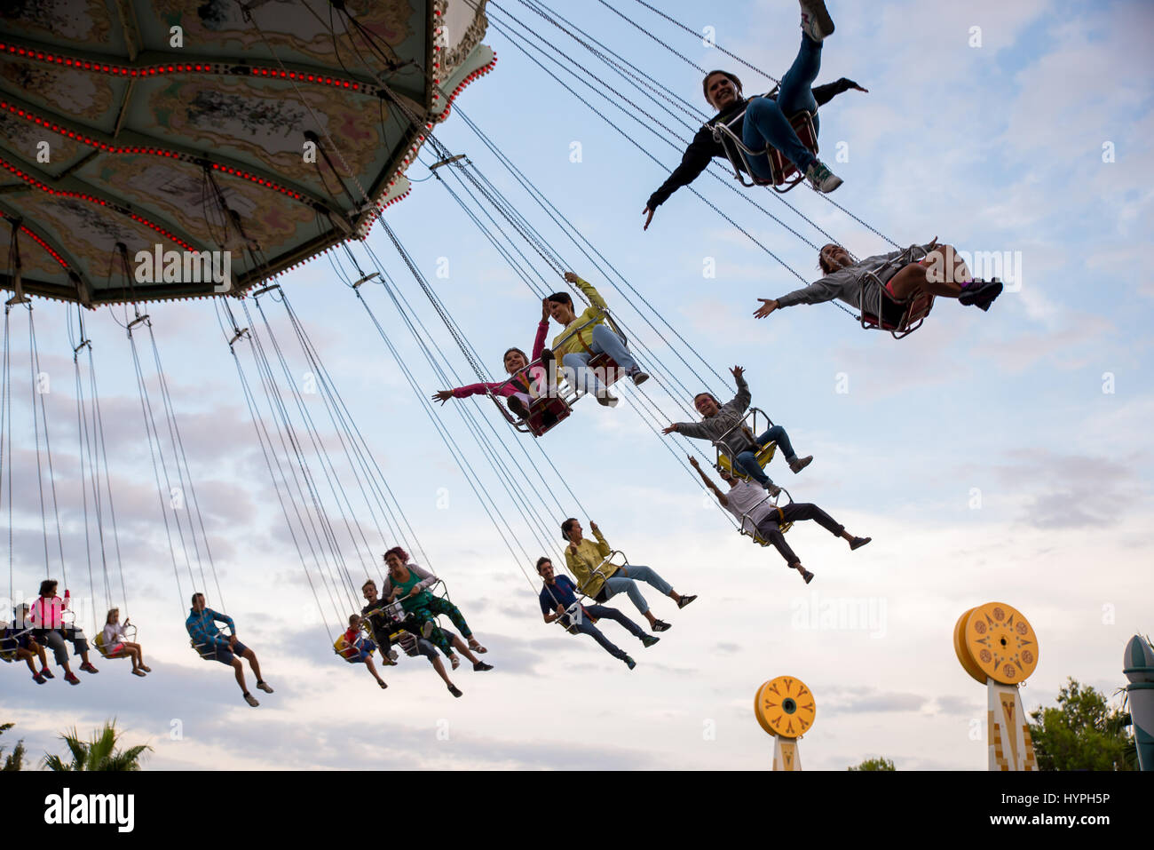 BARCELONA - SEP 5: People have fun at the carousel flying swing ride ...
