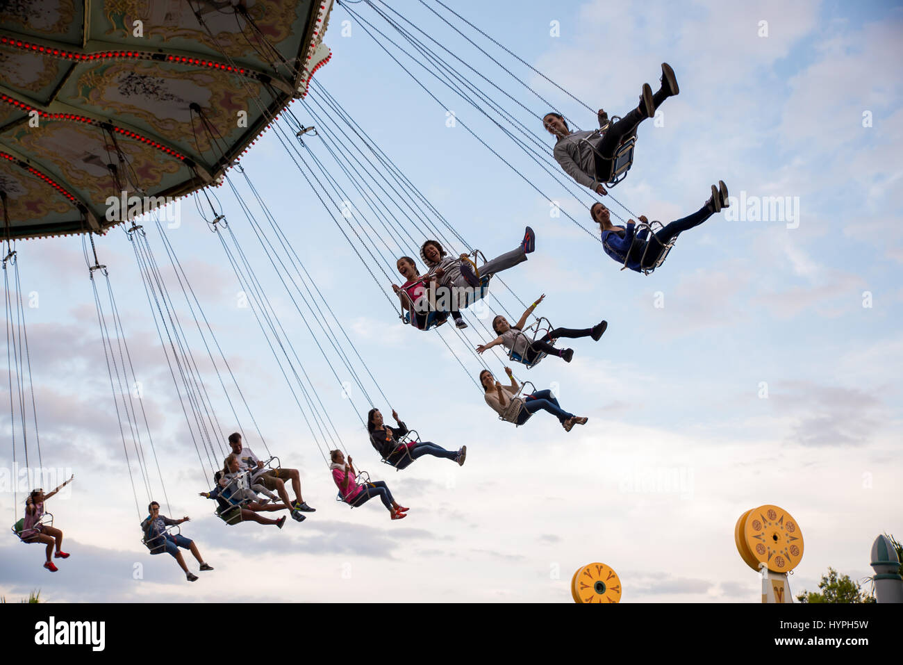 BARCELONA - SEP 5: People have fun at the carousel flying swing ride ...