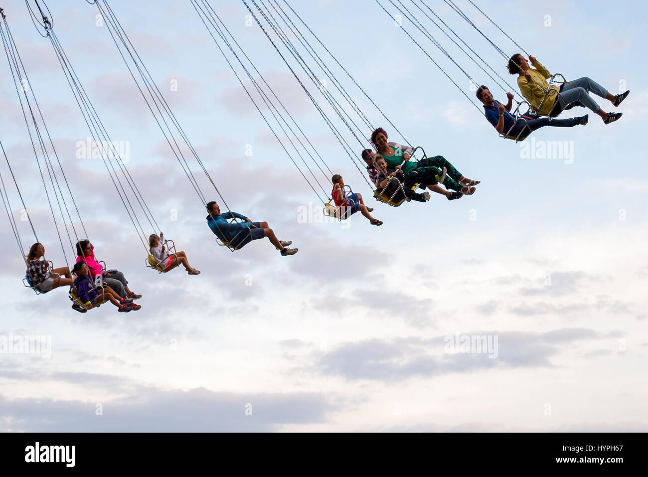 BARCELONA - SEP 5: People have fun at the carousel flying swing ride ...