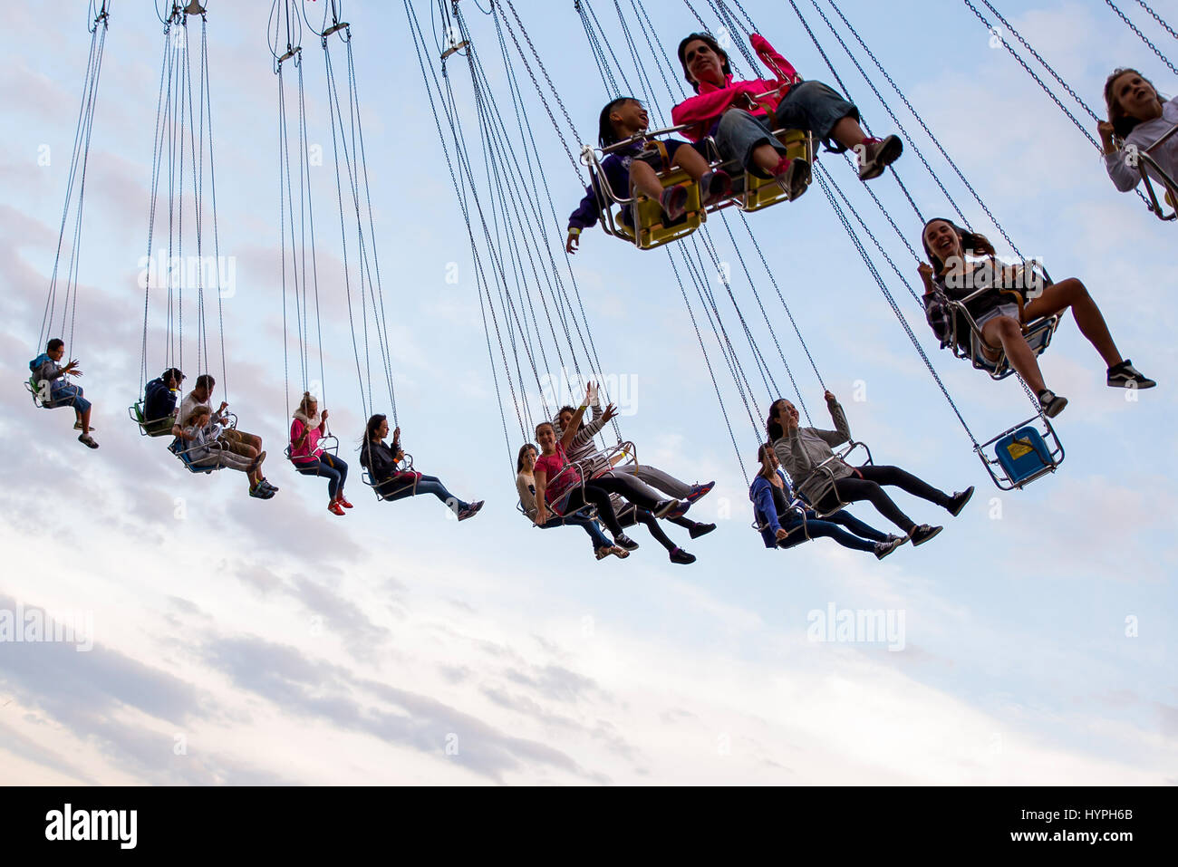 BARCELONA - SEP 5: People have fun at the carousel flying swing ride ...