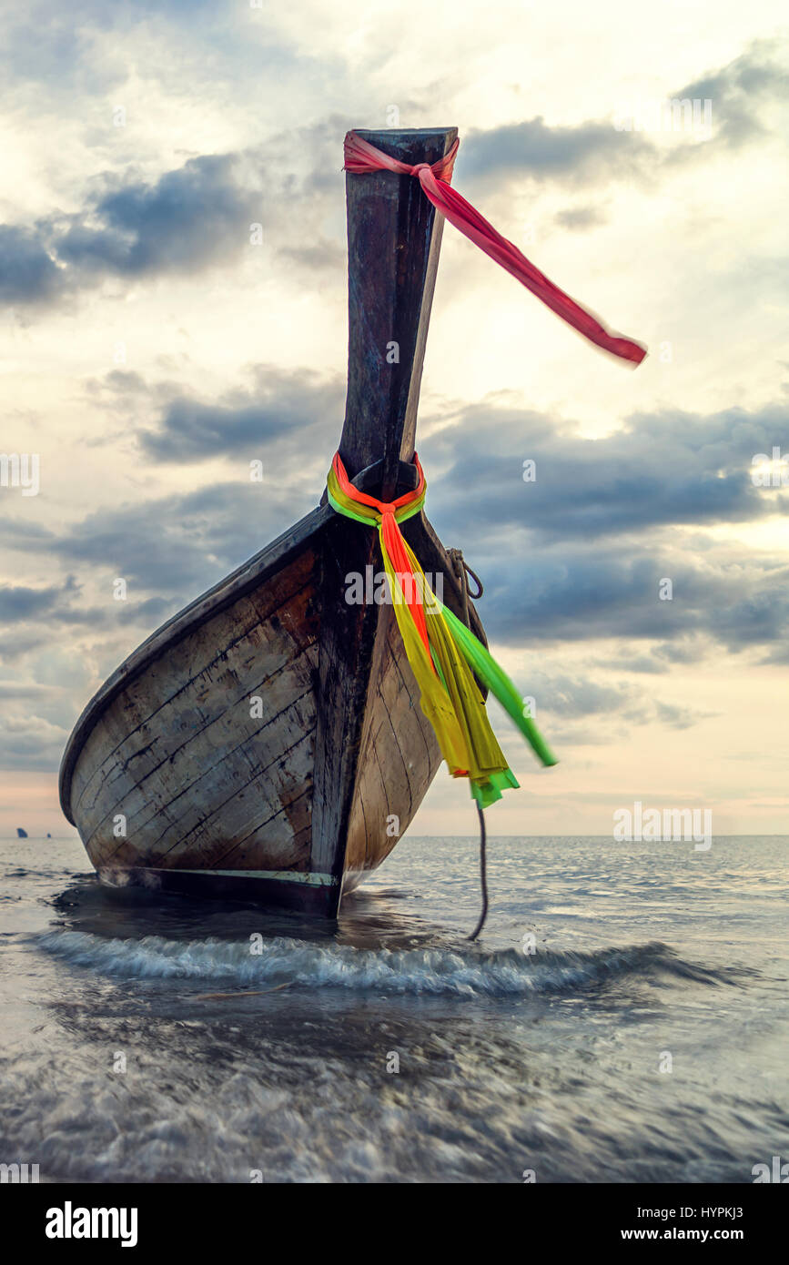 Traditional long-tail boat on the beach in Thailand Stock Photo - Alamy