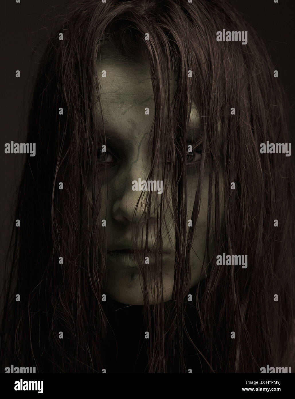 Close up portrait of a demon. Zombie make up, spooky, ugly horror girl ...
