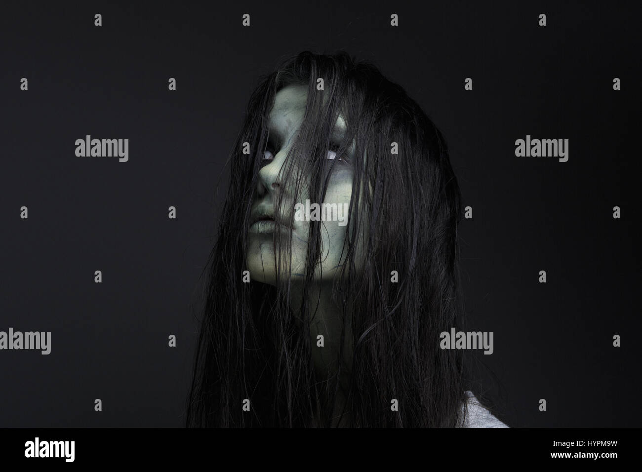Close up portrait of a female zombie on black background Stock Photo ...