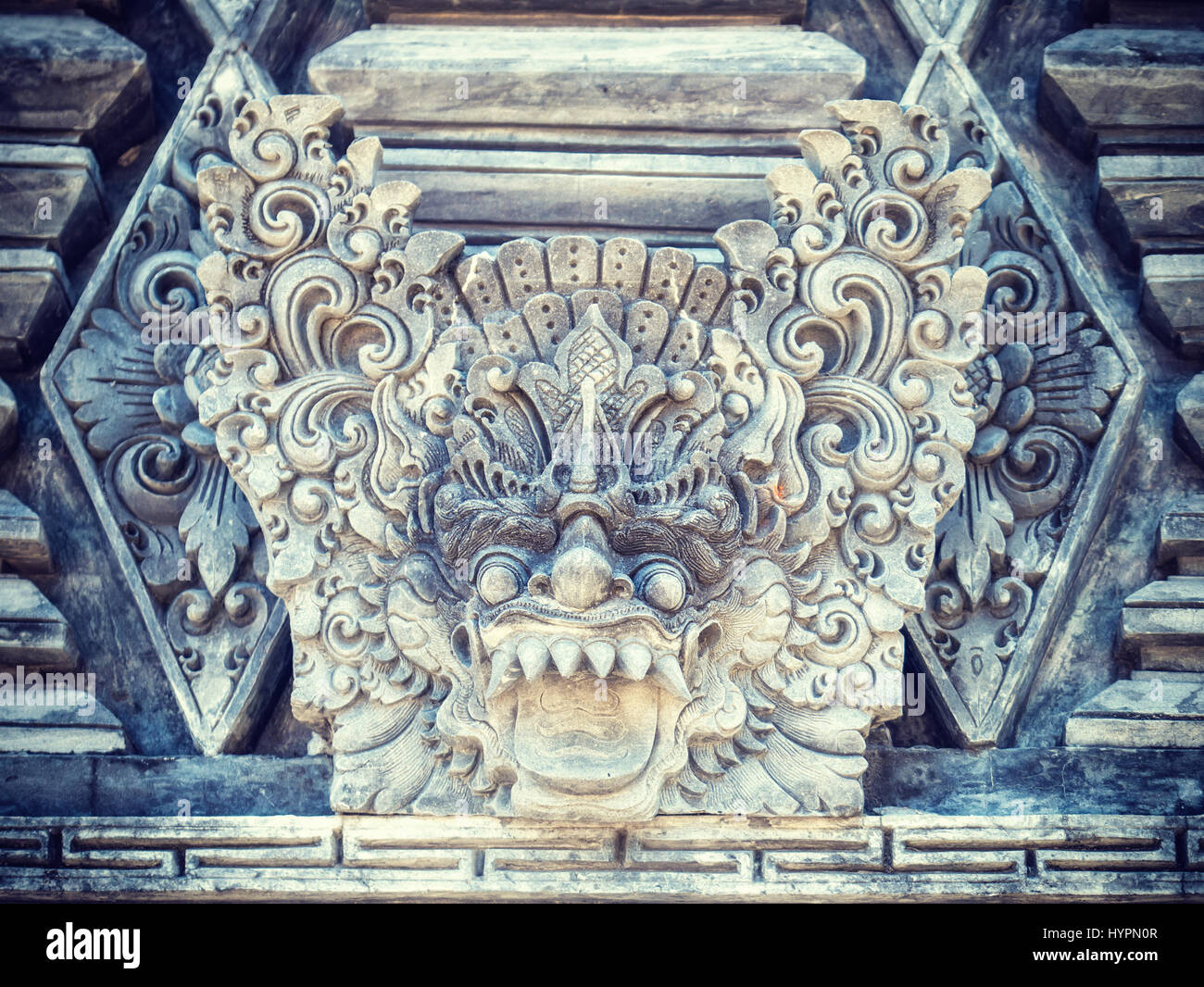 Stone sculpture on entrance door of Pura Padmasana Puja Mandala temple ...