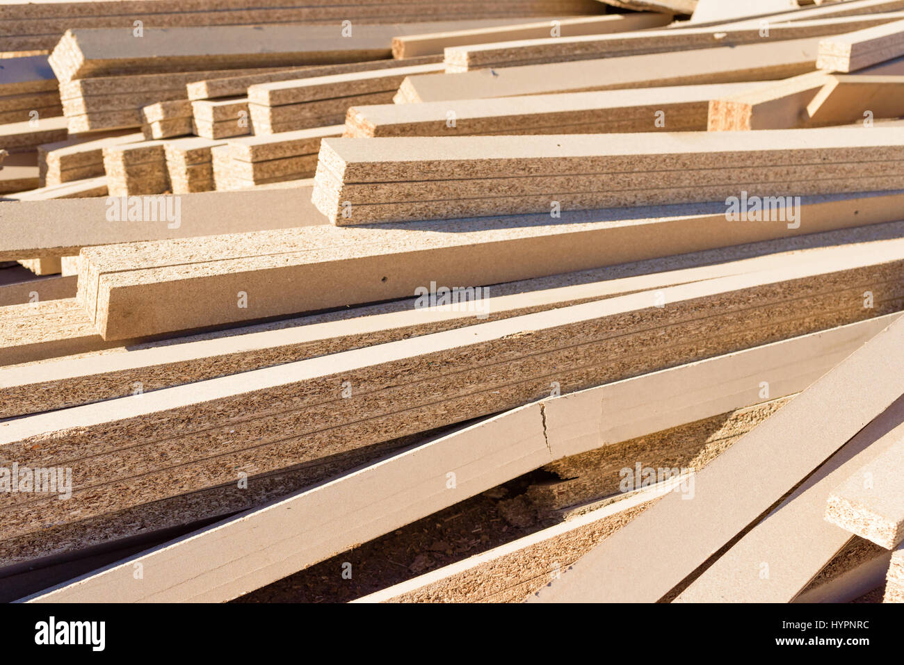 Pile of discarded chipboard parts or planks Stock Photo - Alamy