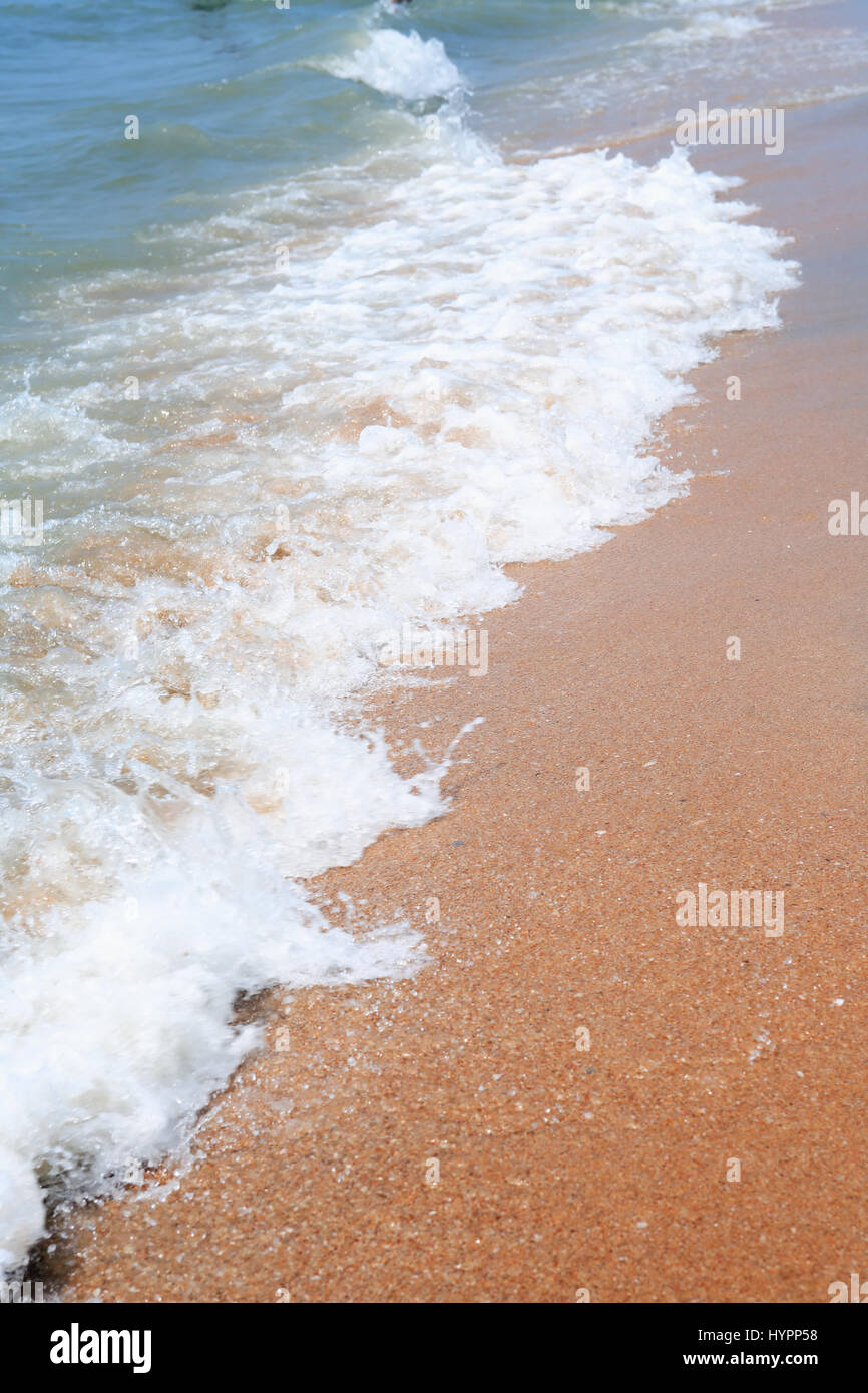 Closeup of sea wave with foam on beach sand. Vacation background Stock ...