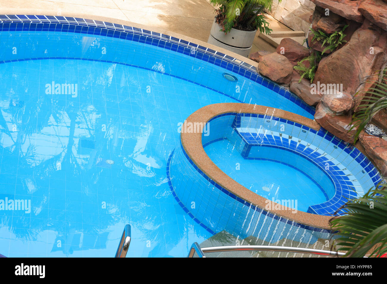 Closeup of elegant empty water pool with blue water near palm Stock ...
