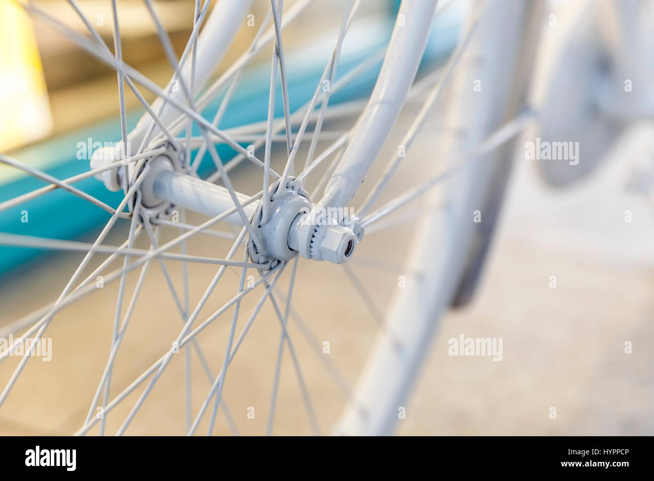 Bicycle painted white standing on the street Stock Photo - Alamy