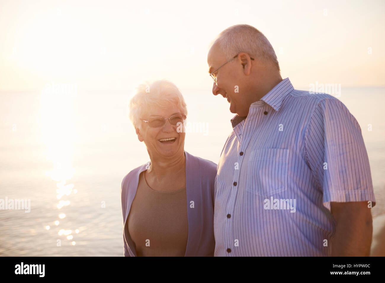 Seniors walking on the beach Stock Photo - Alamy