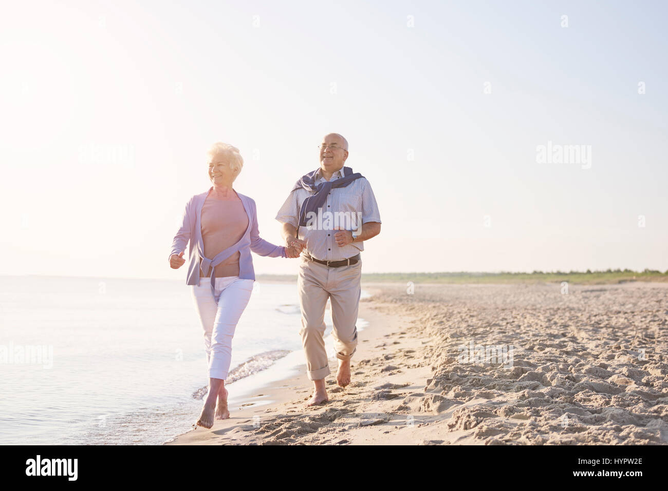 Vital seniors on the beach Stock Photo - Alamy